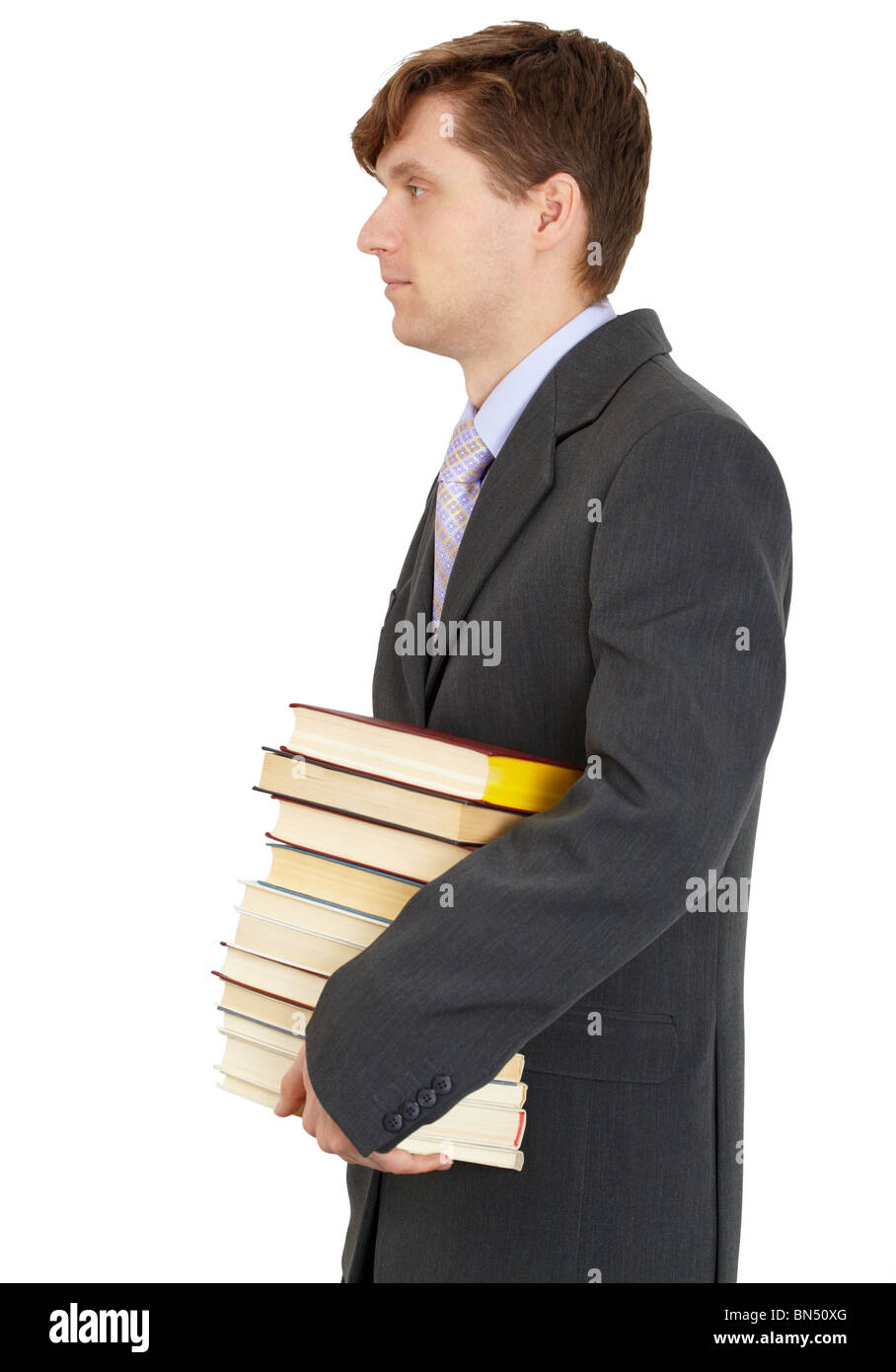 Young man with books under his arm on a white background Stock Photo ...