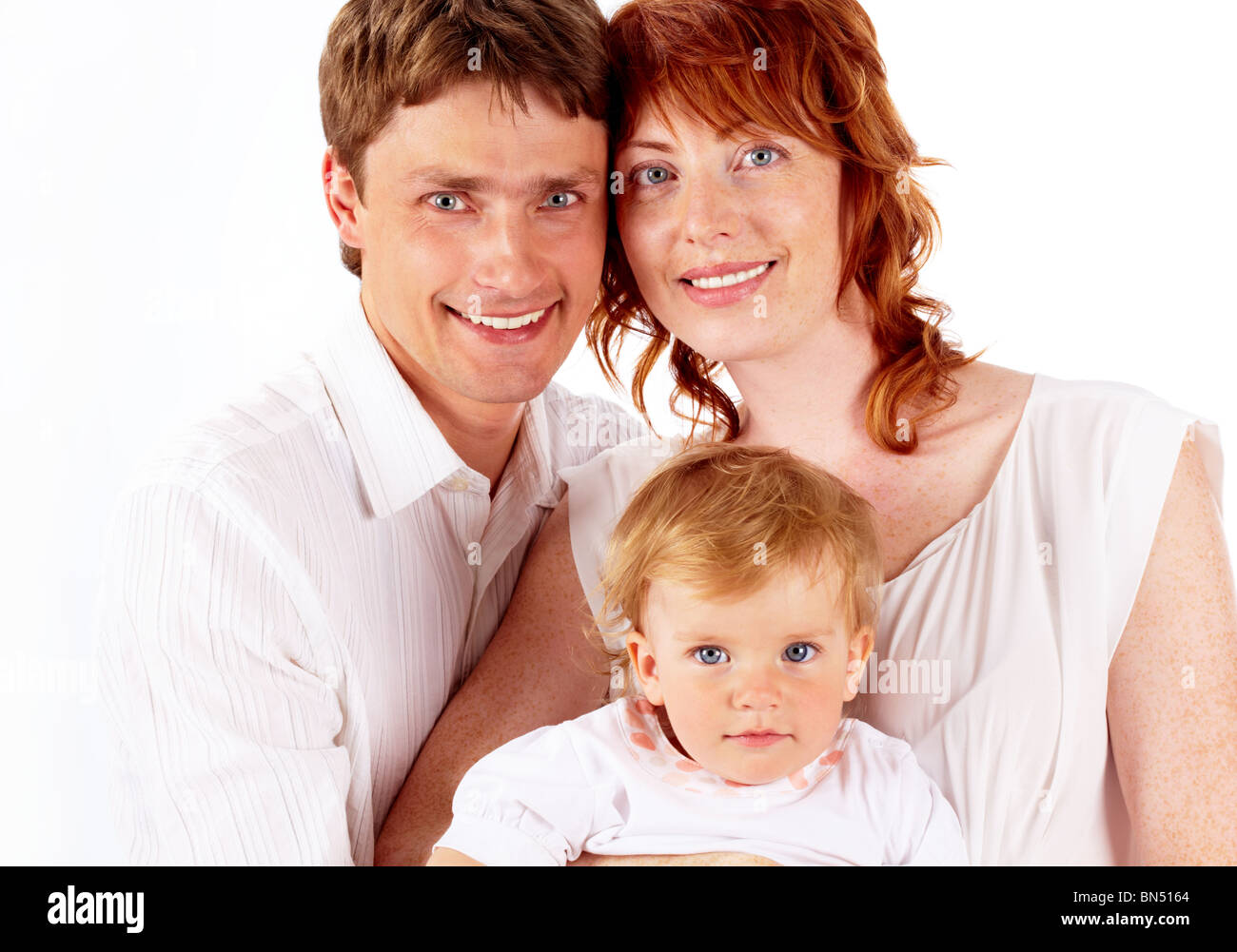 Portrait of joyful family looking at camera over white background Stock ...