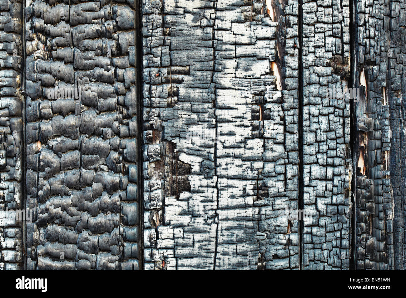 Wall of wooden building damaged by fire - natural background Stock ...