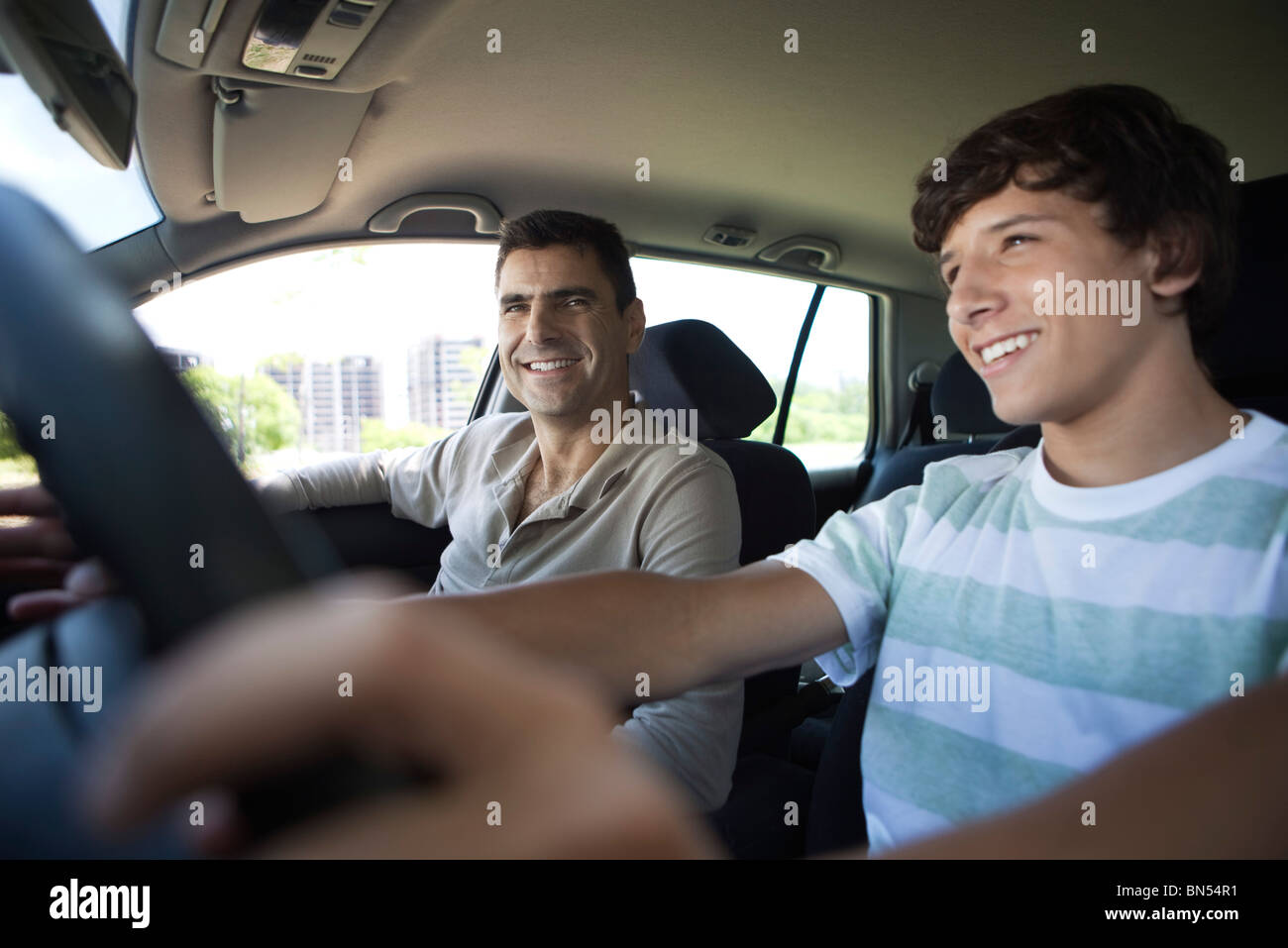 Father teaching son to drive car hi-res stock photography and images ...