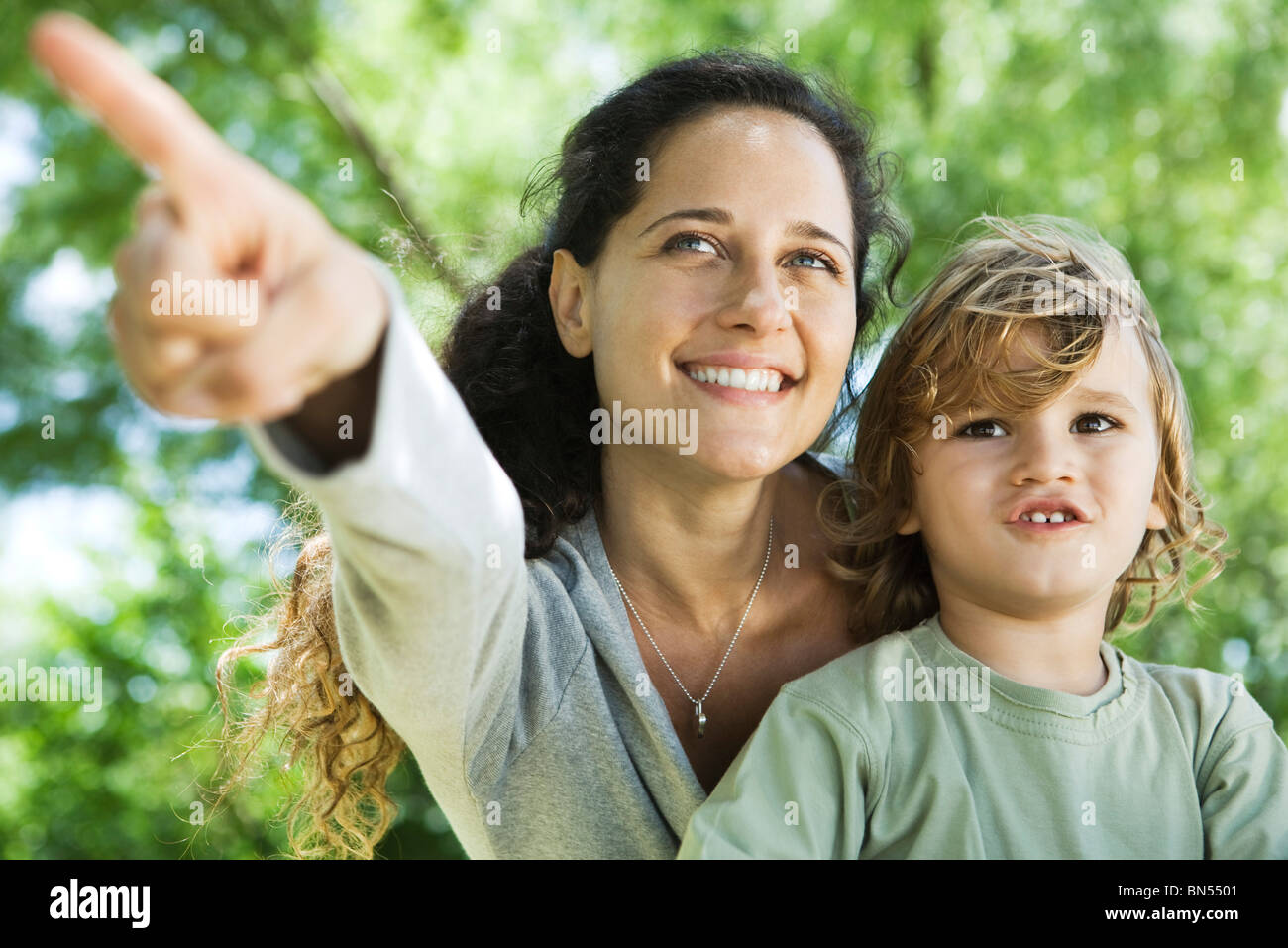 Mother pointing out something young hi-res stock photography and images ...