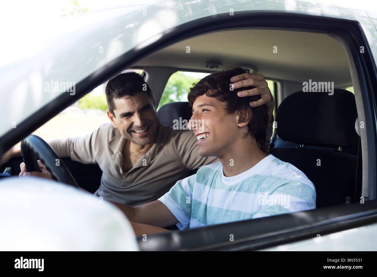 Father teaching his son to drive Stock Photo - Alamy
