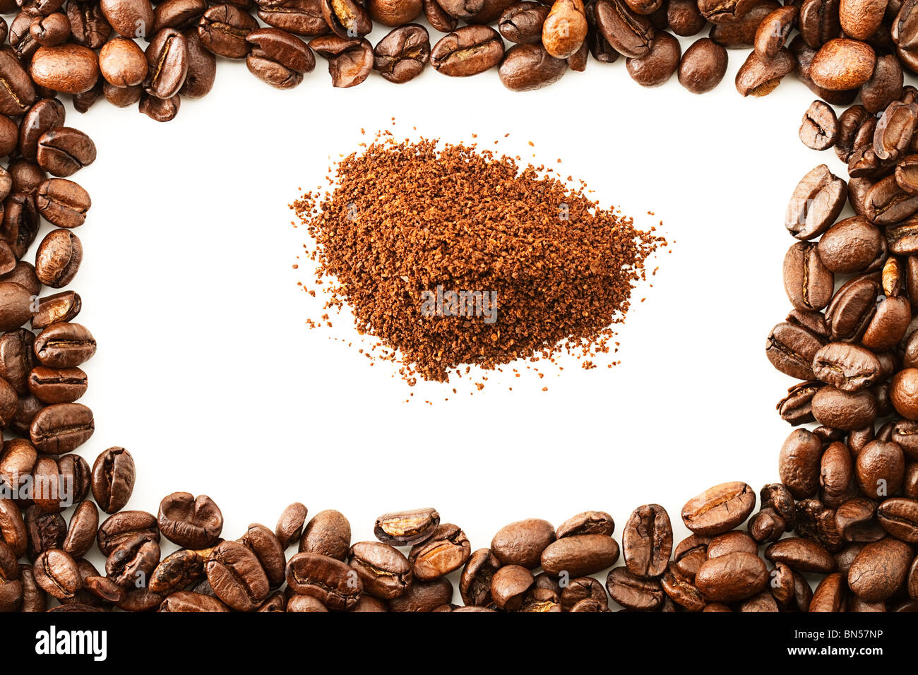 some coffee grain surrounded by coffee beans on white background Stock ...
