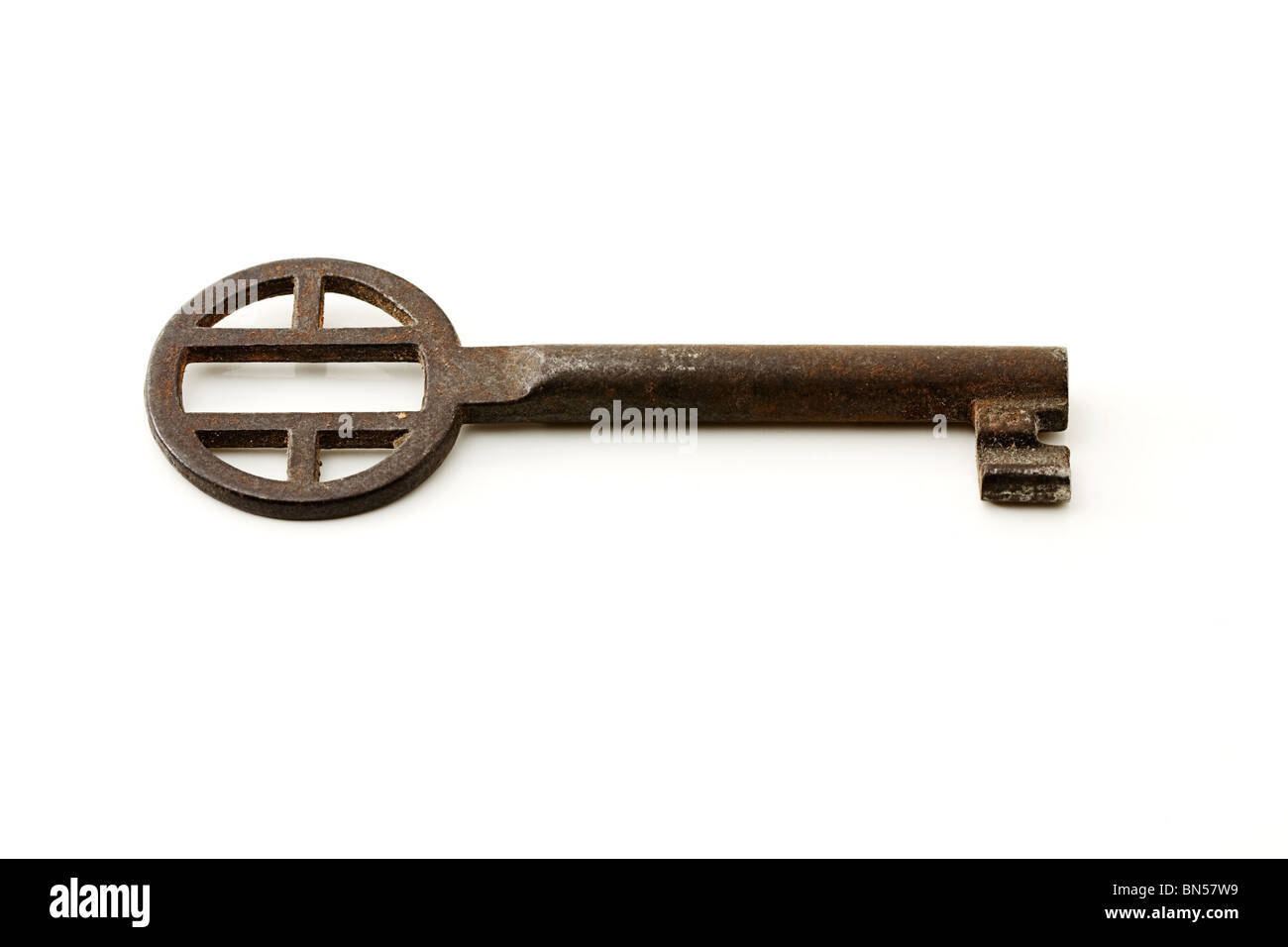 one small rusty key on white background Stock Photo - Alamy