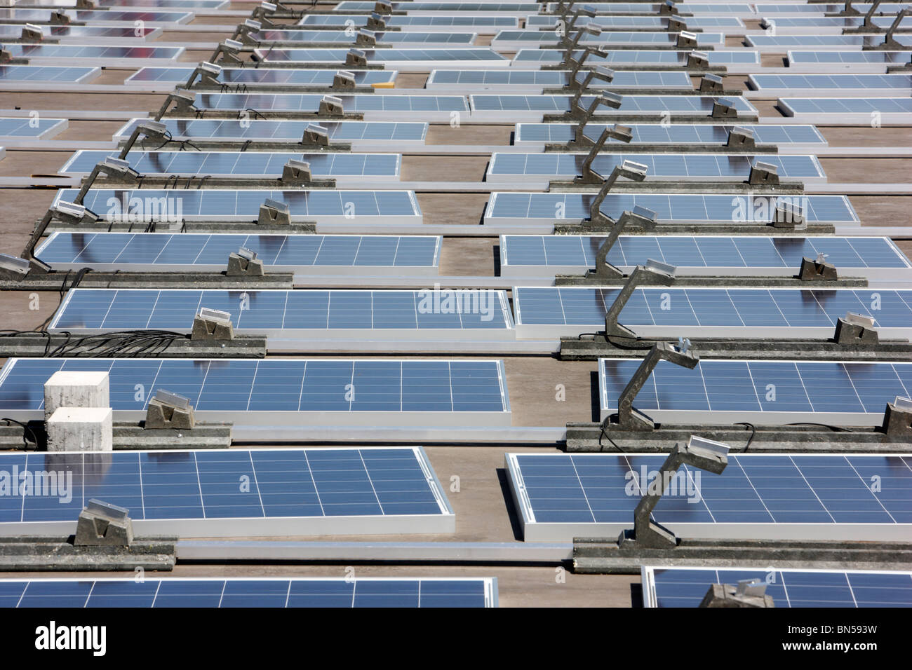 Construction of a big solar power plant, on a huge flat roof of a ...