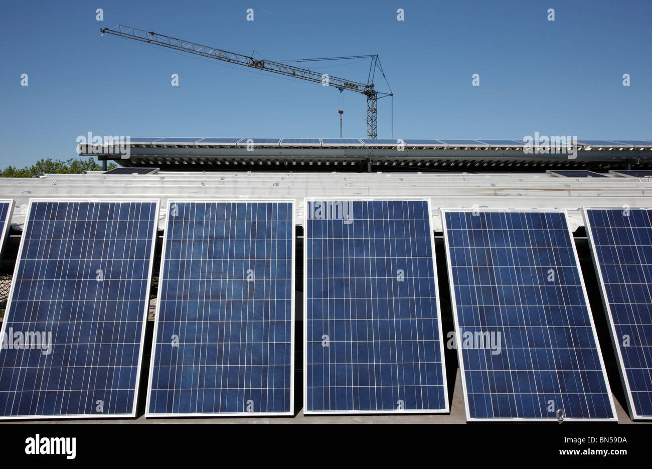 Construction of a big solar power plant, on a huge flat roof of a ...
