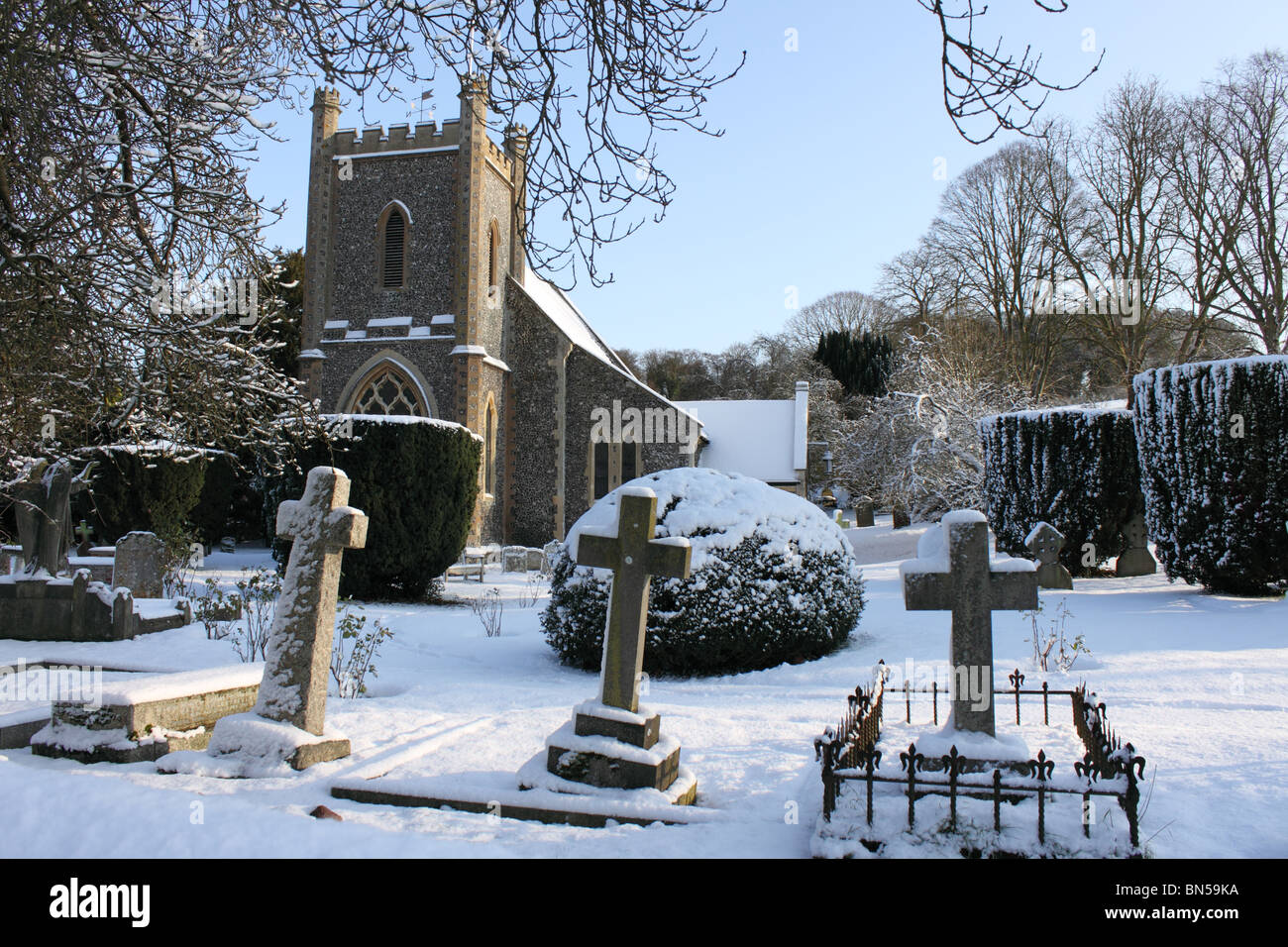 Remenham Church of Saint Nicholas and graveyard in snow, Berkshire ...