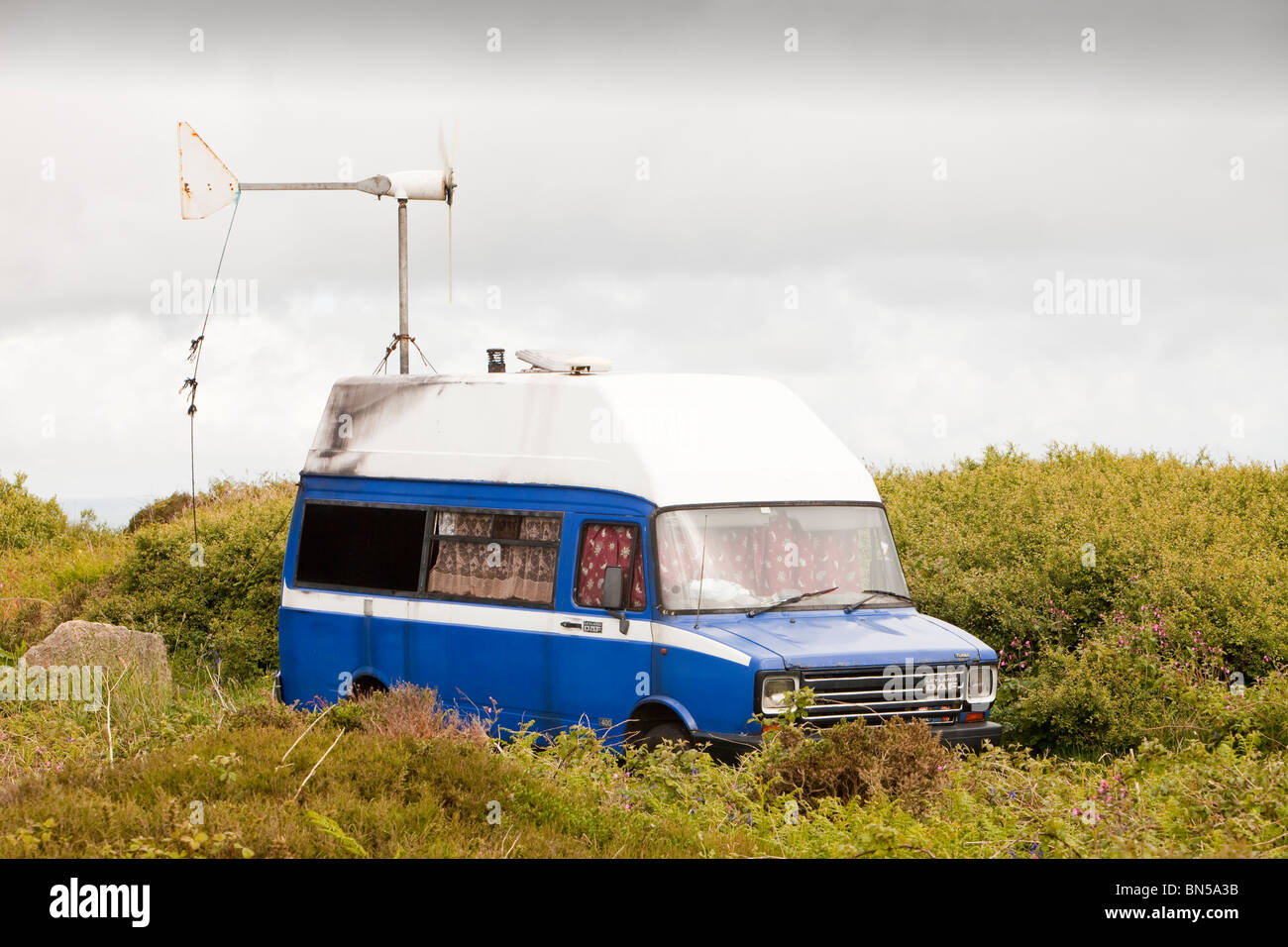 A travellers camper van with a wind turbine used to power a computer ...