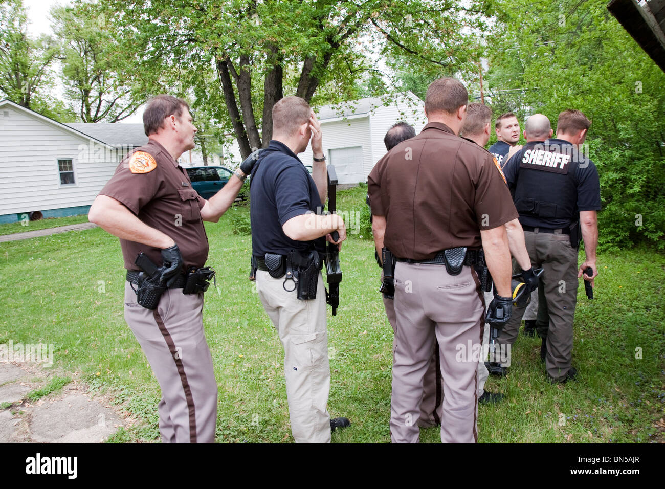 Deputy sheriff's serving drug related search warrant in a rural US ...