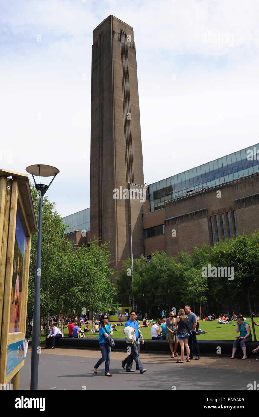 Tate Modern Art Gallery and people sunbathing on the grass. Southbank ...