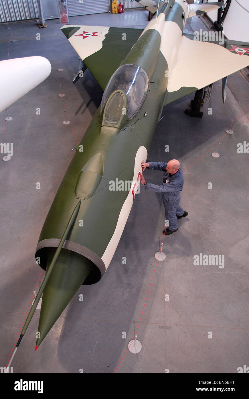 Technician Mick Rose putting the finishing touches to a Hungarian Mig ...