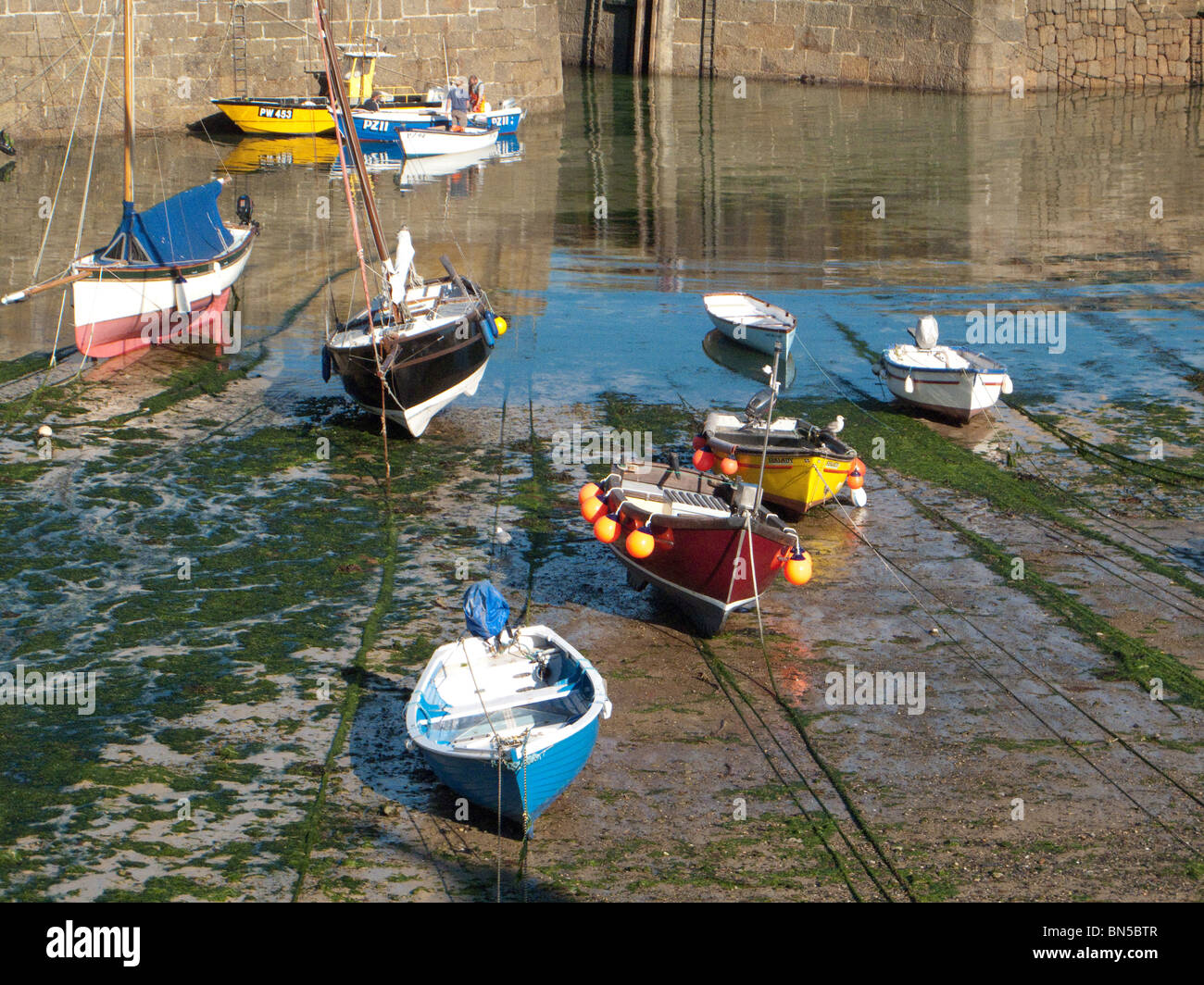 Cornwall England Mousehole harbour wall fishing boats beach Stock Photo ...