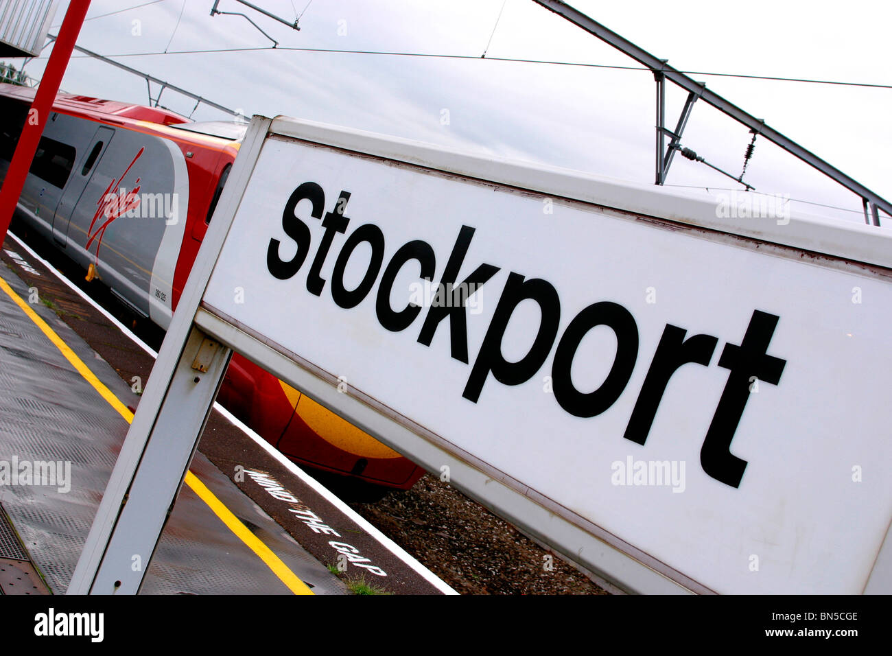 England, Cheshire, Stockport, transport, railway station, sign on ...