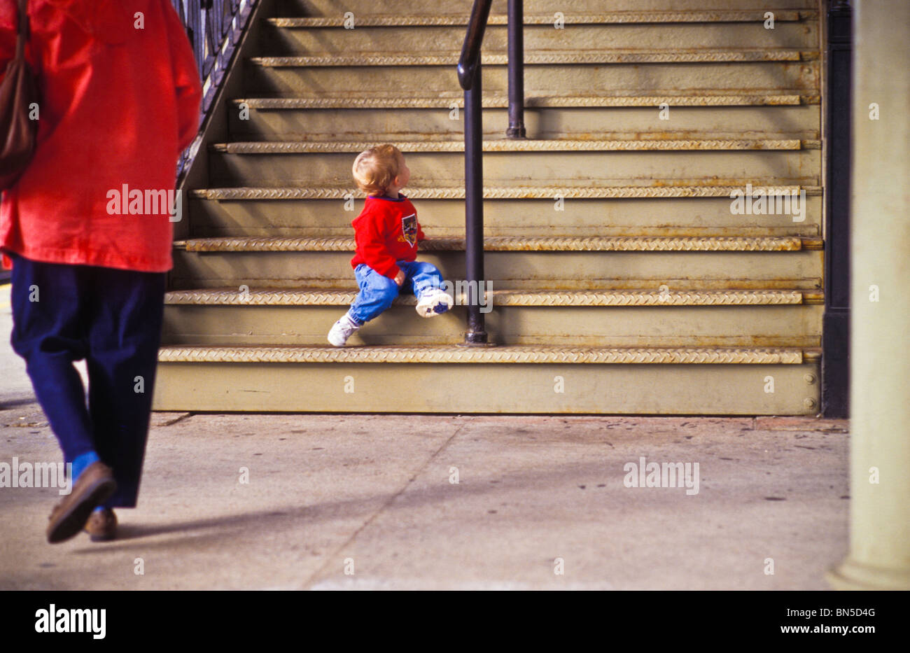 Young boy mother await family arrival Stock Photo - Alamy