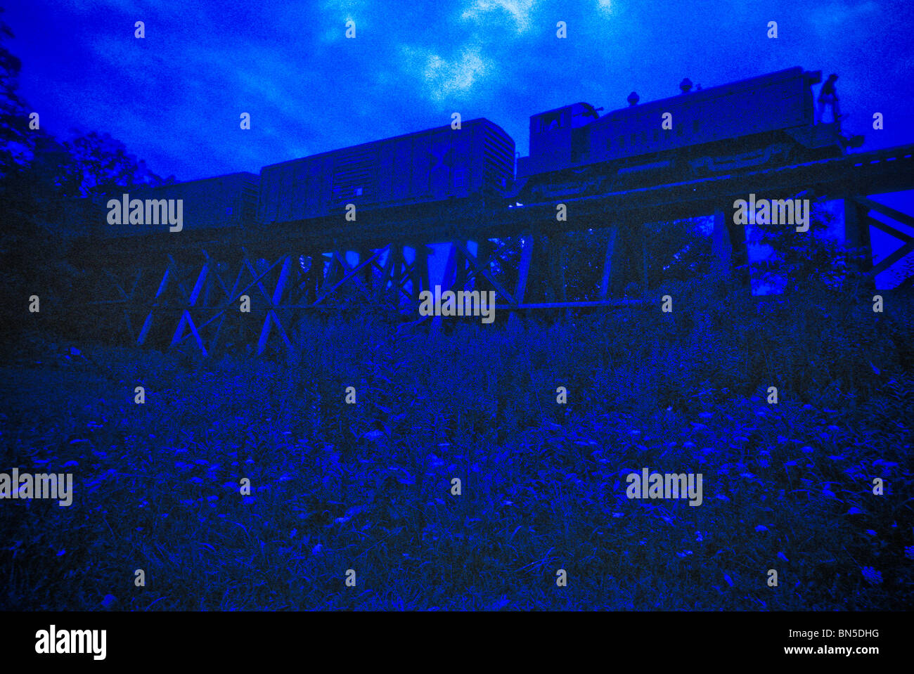 Freight train crossing bridge Stock Photo - Alamy