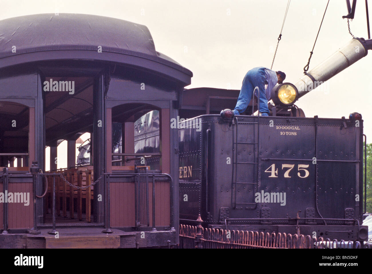 Conductor engineer fireman connect to water tower Stock Photo - Alamy