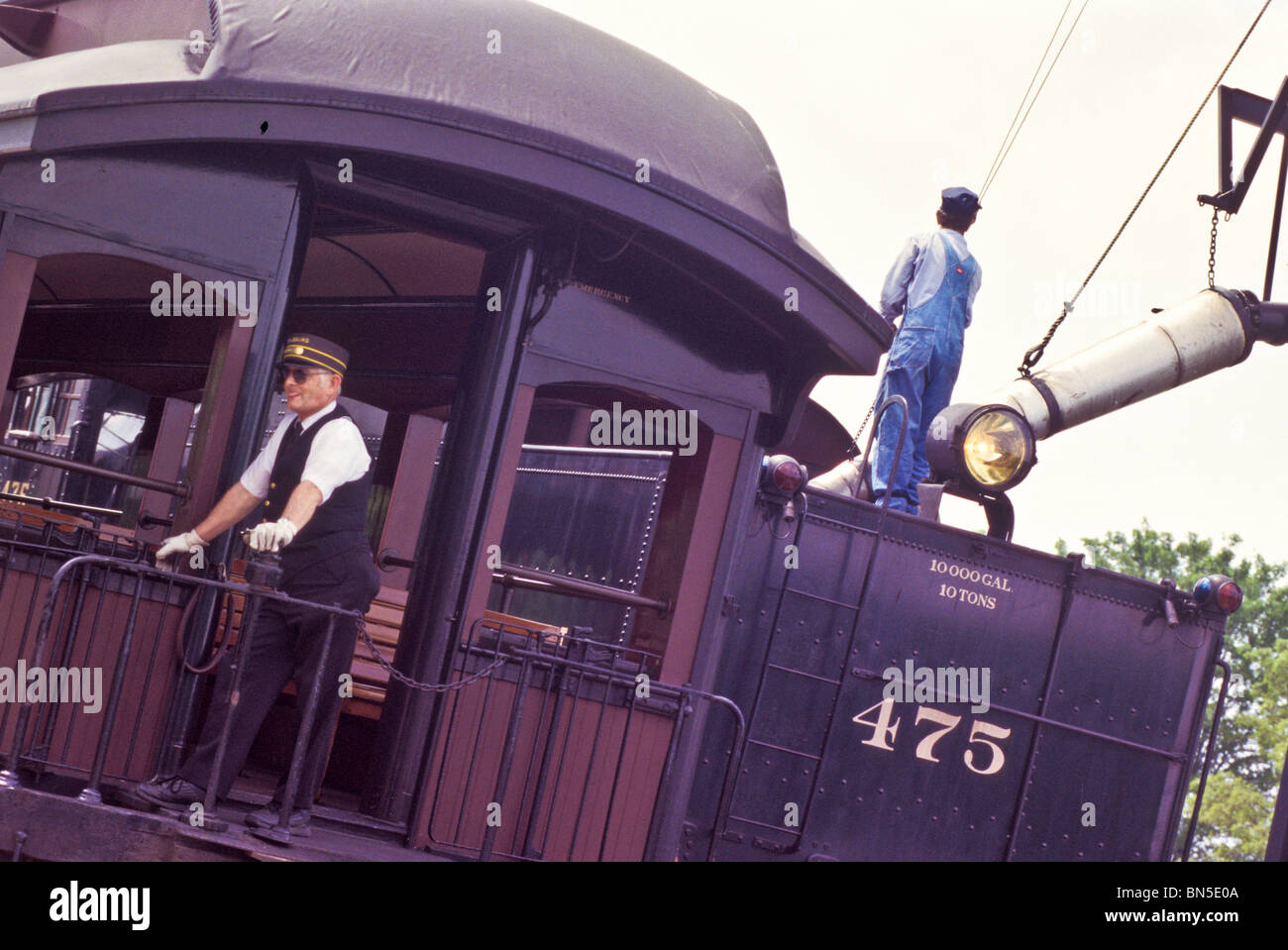 Conductor engineer fireman connect to water tower Stock Photo - Alamy