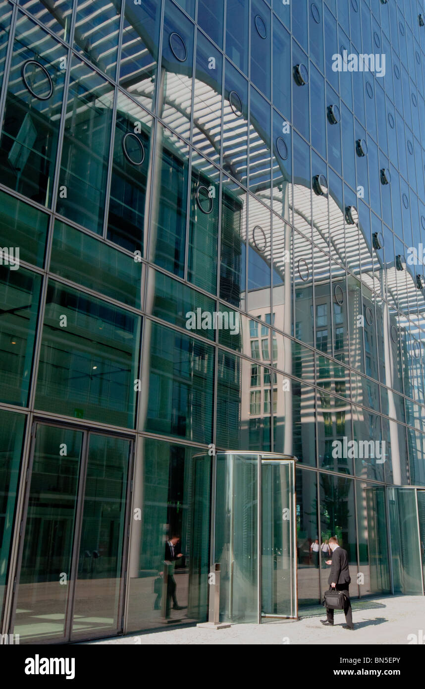 Businessman with mobile phone enters O2 Germany's headquarters in ...