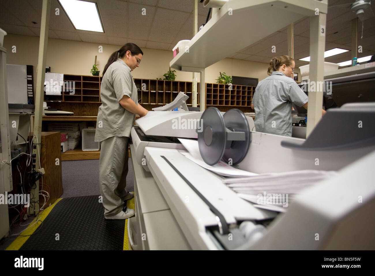 Female inmates from work release working in the mail room at the ...