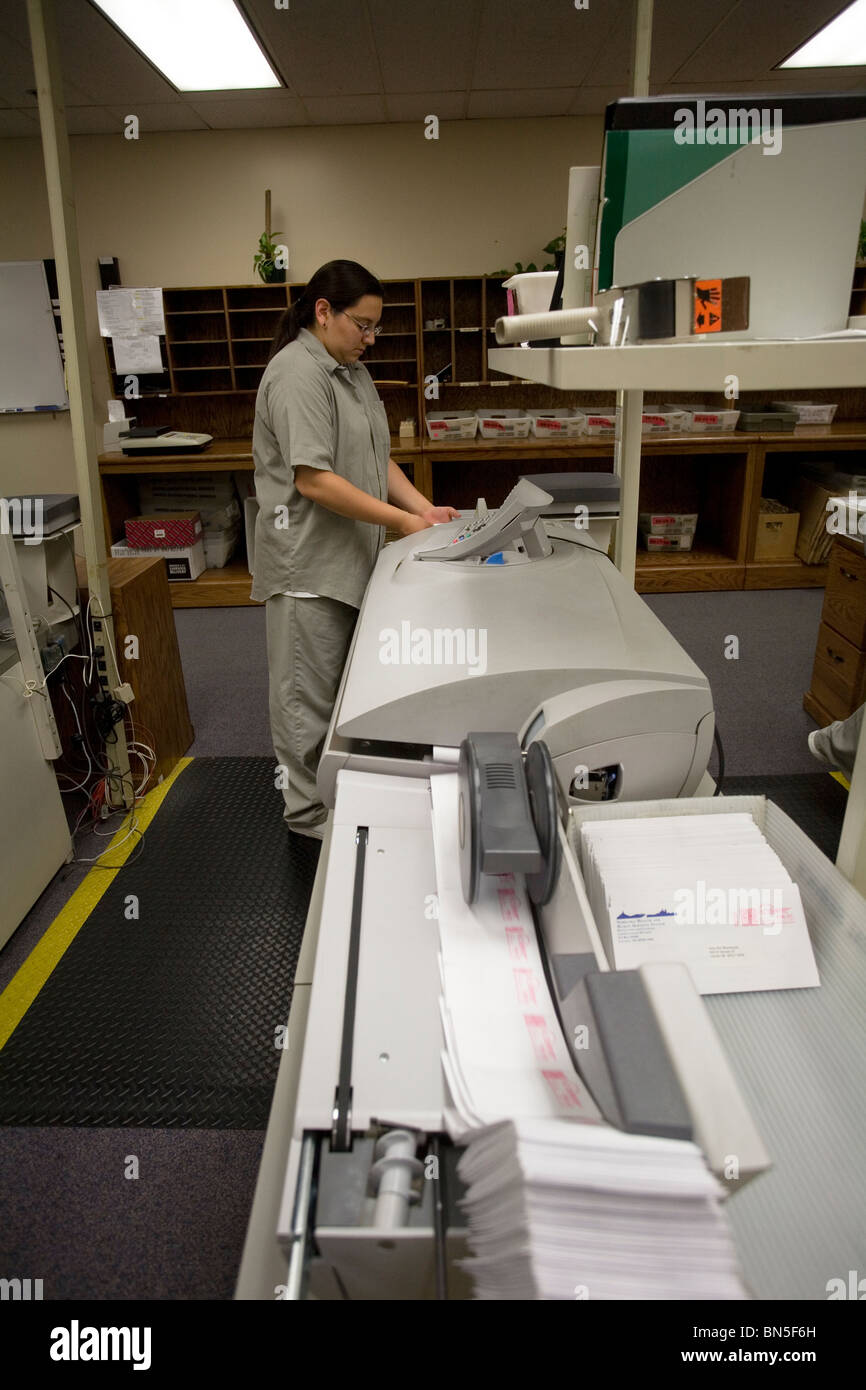 Female inmates from work release working in the mail room at the ...