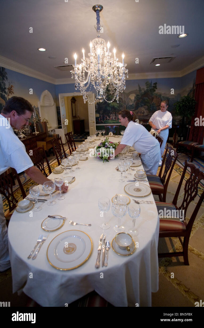 Inmates from work release setting the tables for a state dinner at the ...