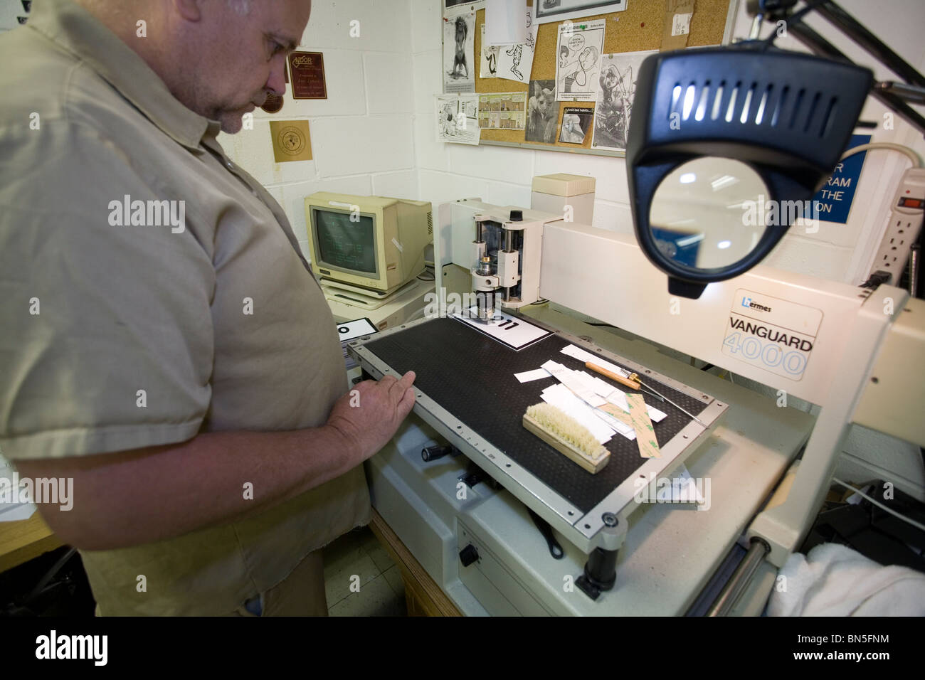 Inmate working making plaques at the Nebraska State Penitentiary. Work ...