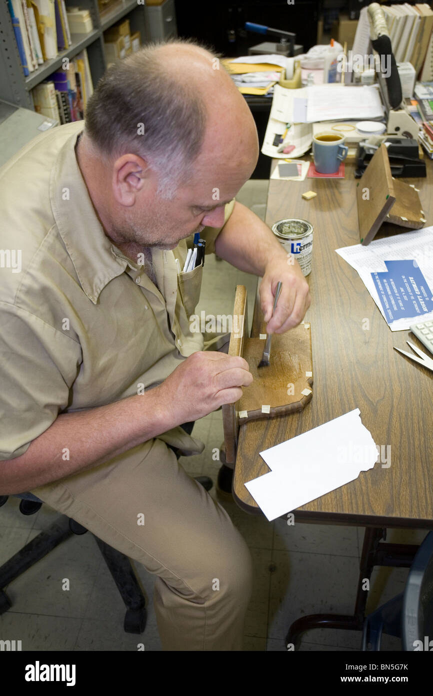 Inmate working making plaques at the Nebraska State Penitentiary. Work ...