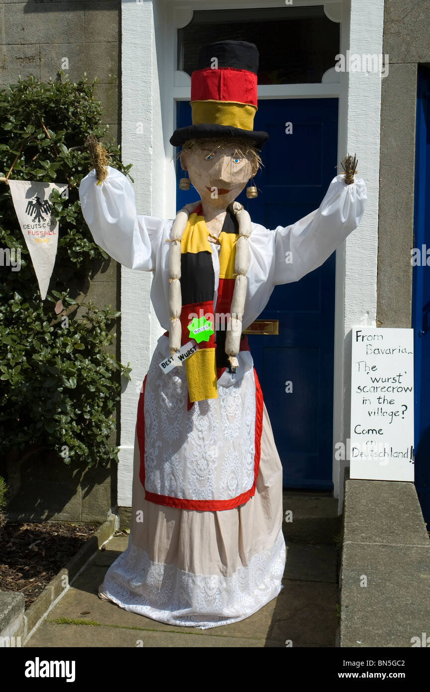 The wurst scarecrow in the village. At the Wray Scarecrow Festival, in ...