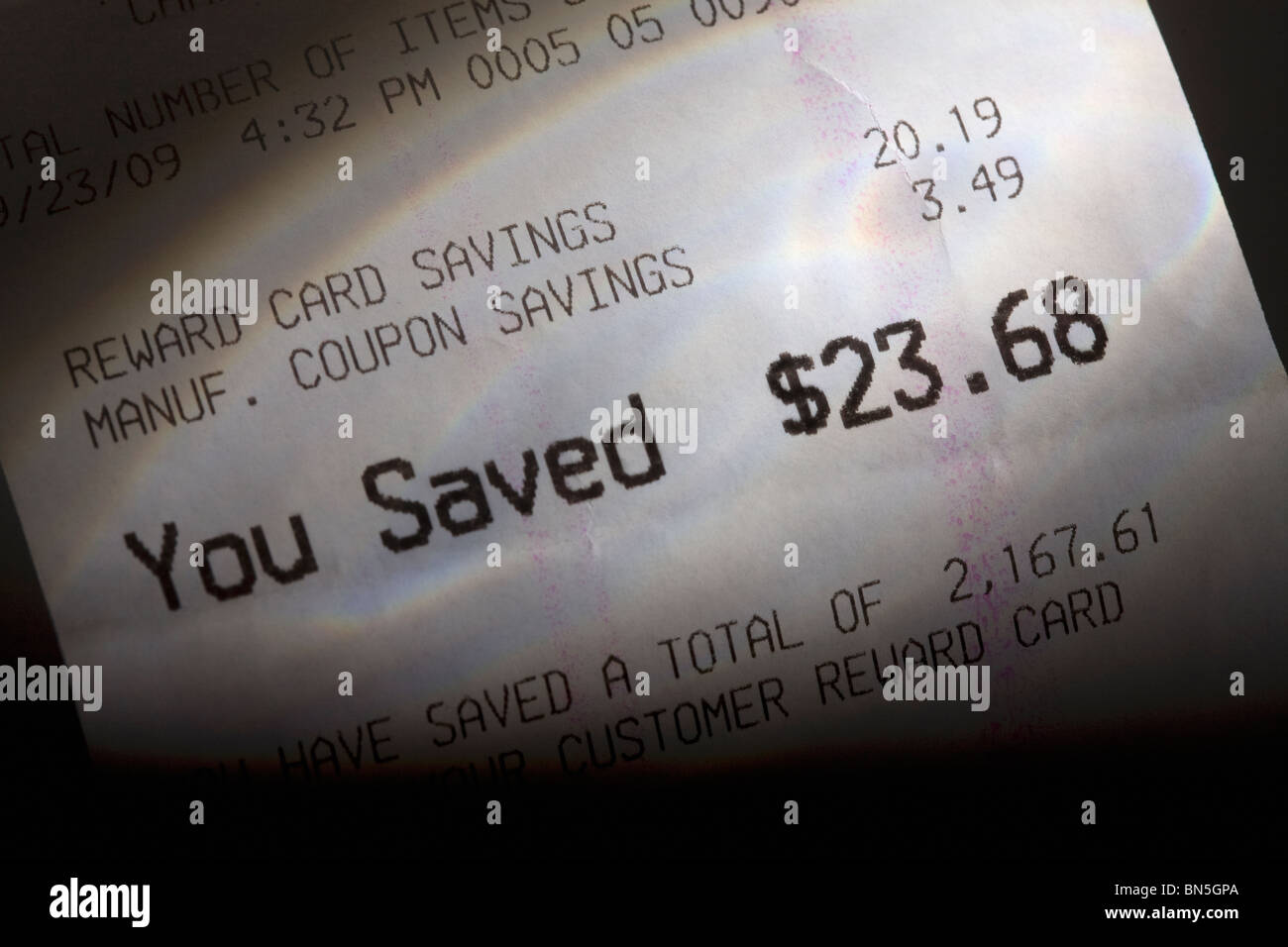 Grocery list savings on a receipt Stock Photo - Alamy