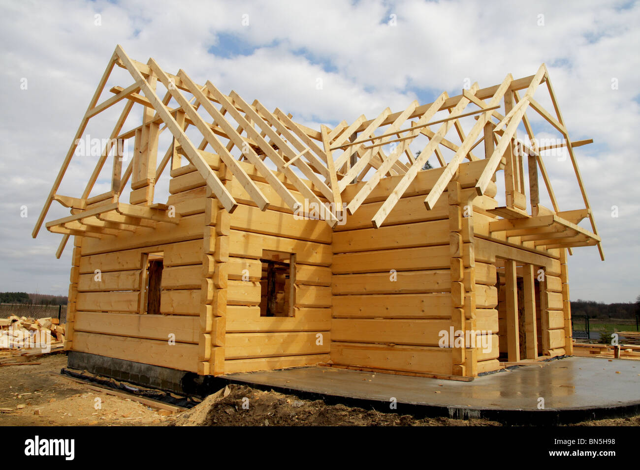 Unfinished, ecological wooden house and building area Stock Photo - Alamy