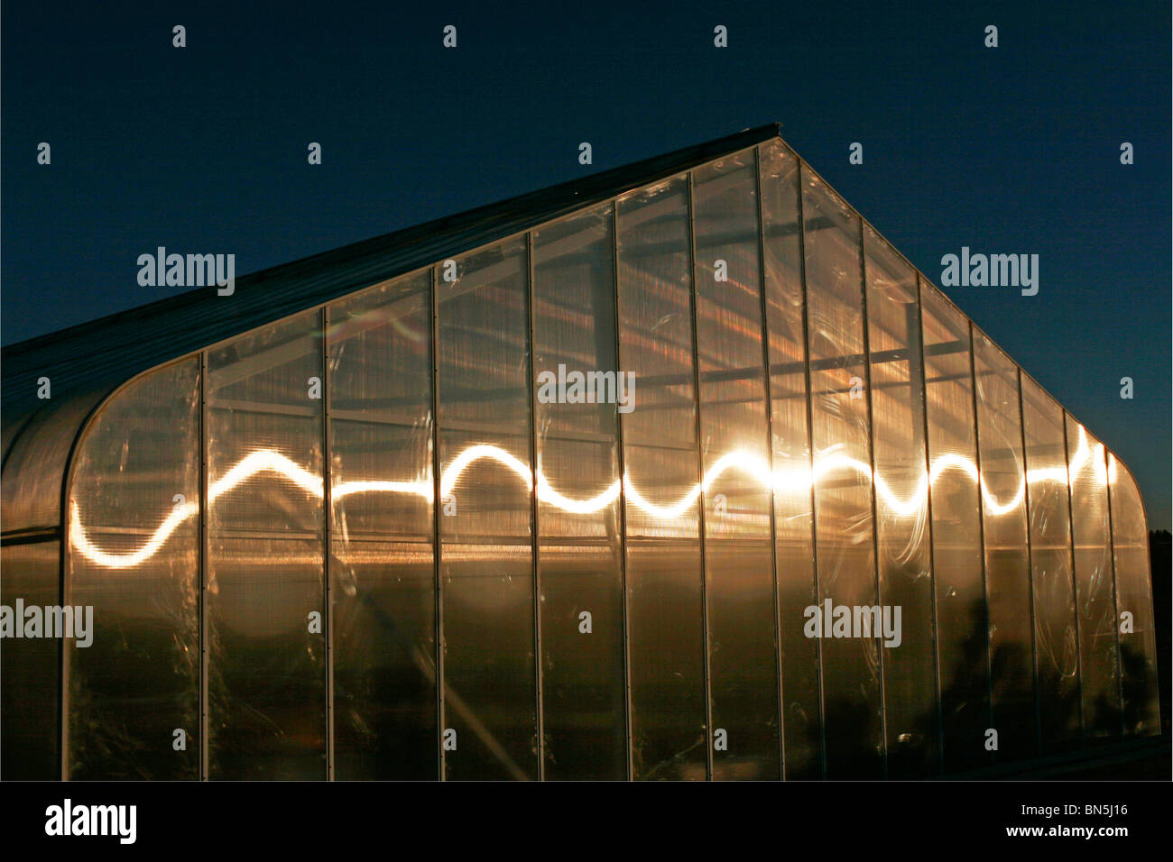 Garden greenhouse with swirl reflection Stock Photo - Alamy