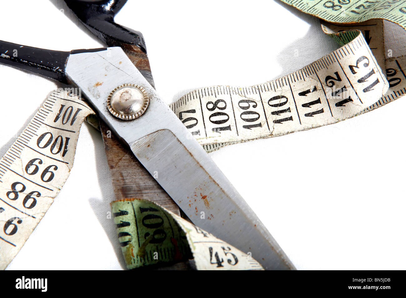 scissor and a tape-measure Stock Photo - Alamy