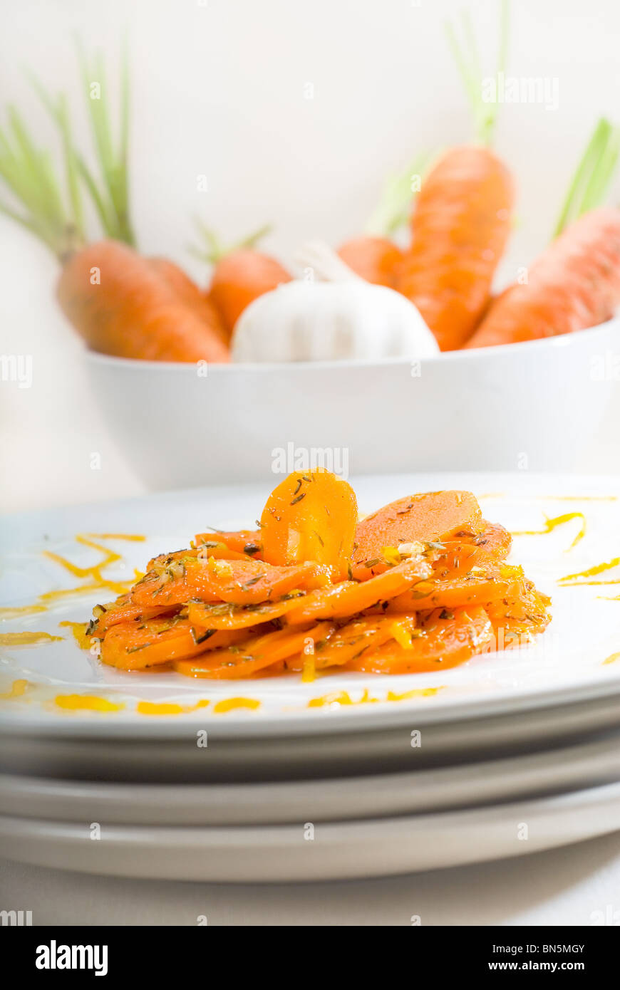 fresh and healthy Honey glazed carrots on a plate with tyme on top ...