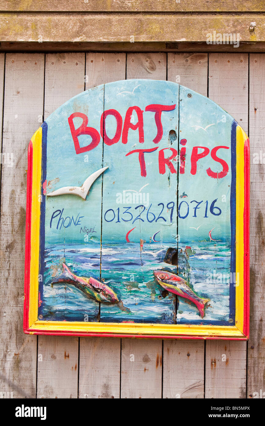 A sign advertising boat trips in Cadgwith, cpornwall, UK Stock Photo ...
