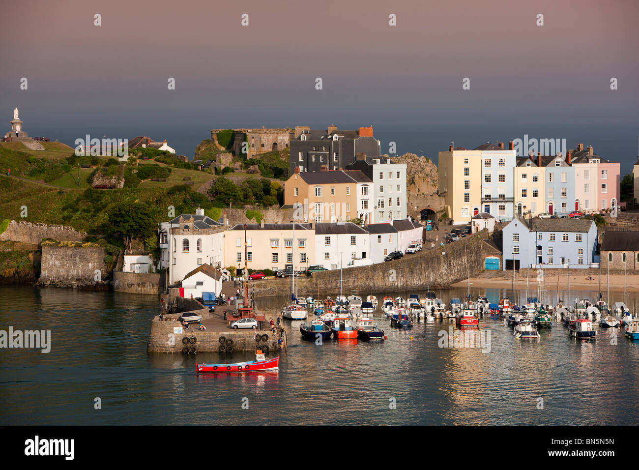 The fishing port and harbour of the holiday resort town of Tenby in ...