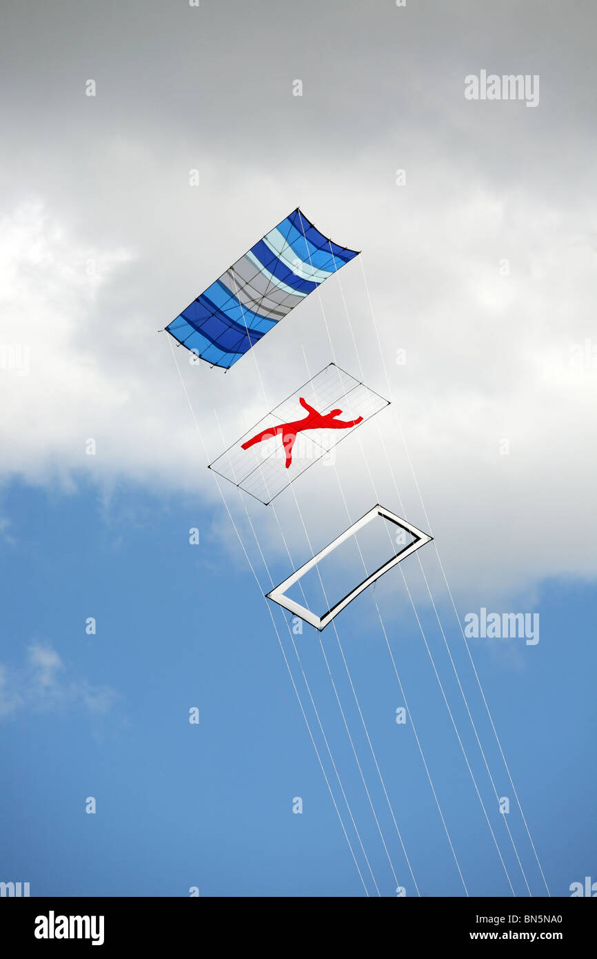 A three piece kite showing a figure outlined in a window against a ...