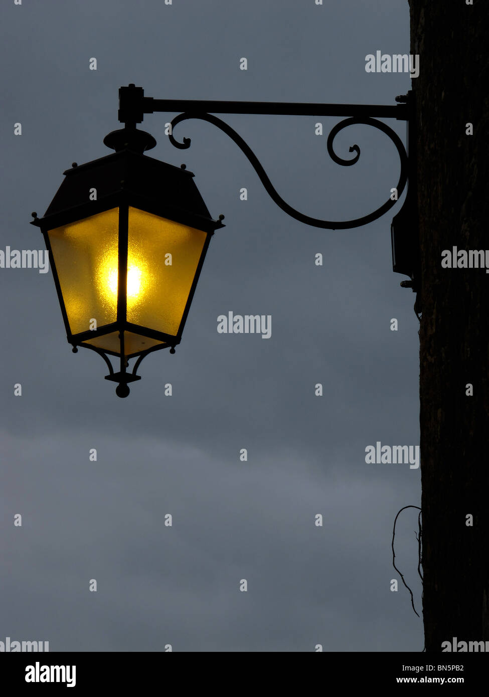 French street lamp with a wonderful glow, Salignac, the Dordogne Stock ...