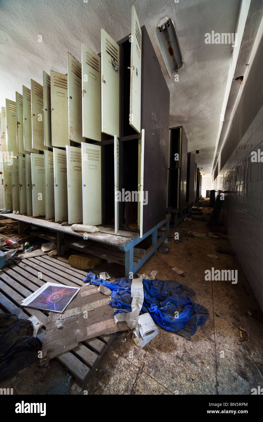 Garment workers in an old factory which is now closed and abandoned ...