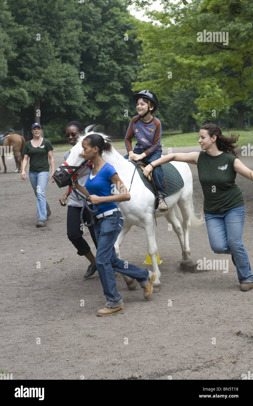Disabled children receive developmental therapy learning to ride horses ...