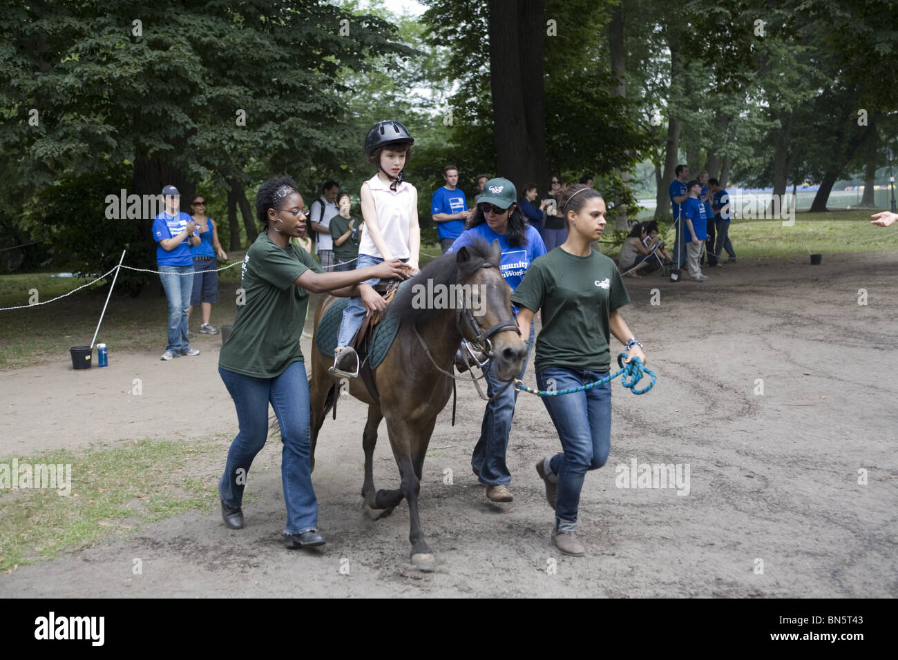 Disabled children receive developmental therapy learning to ride horses ...
