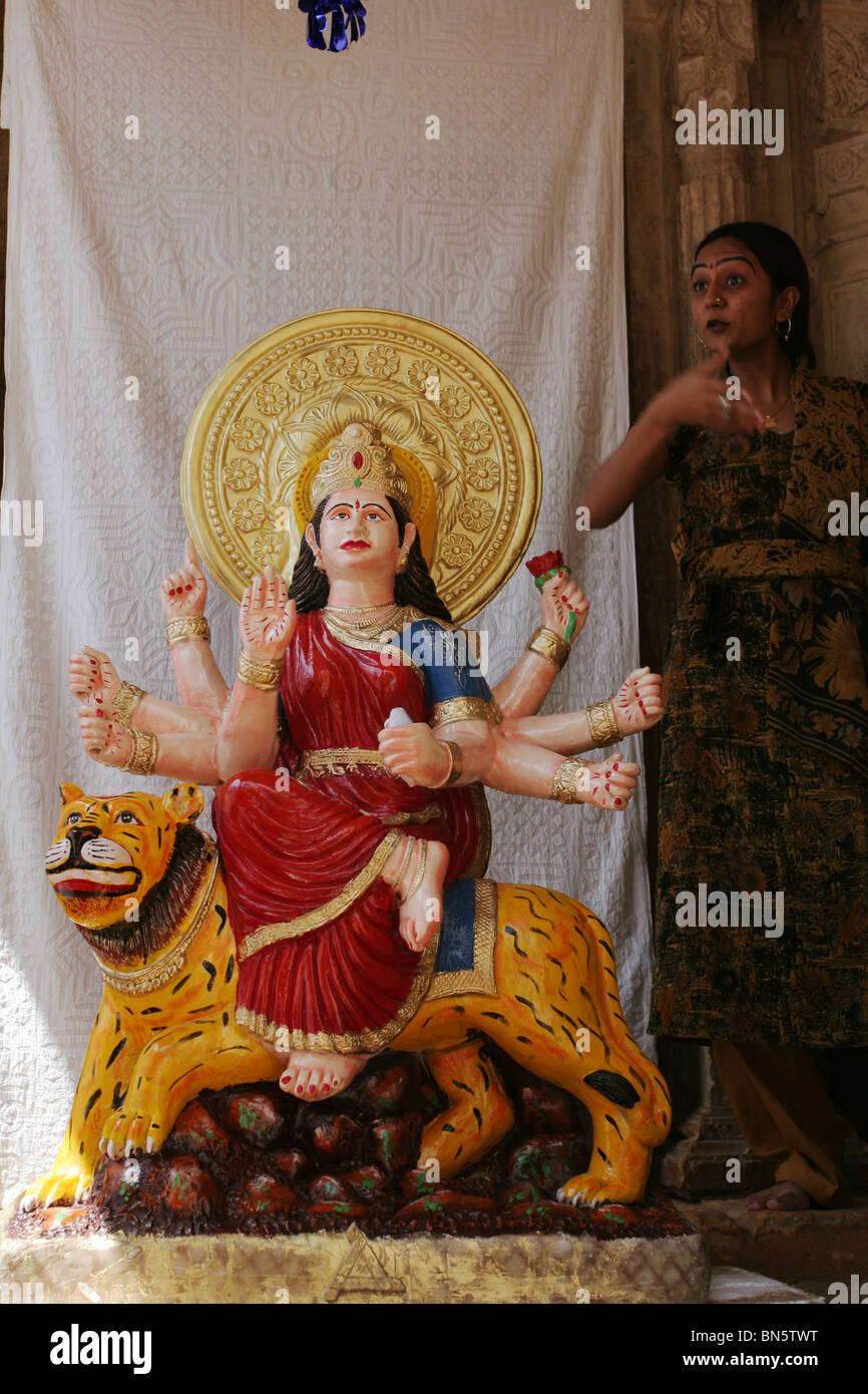 Pilgrim in front of a shrine of a female Hindu deity, Jaisalmer ...