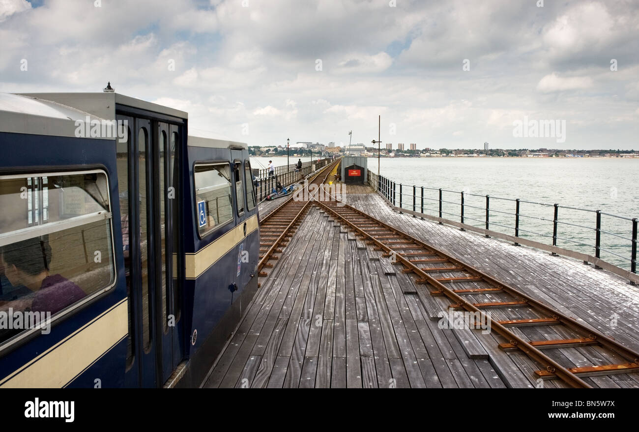 An electric train arriving at the pier head station on Southend Pier in ...