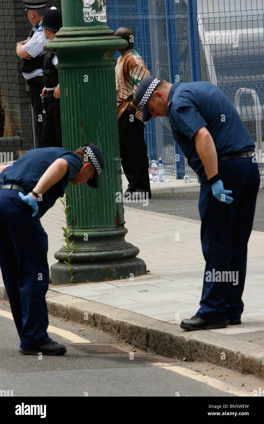 police forensic team search South London street for evidence after a ...