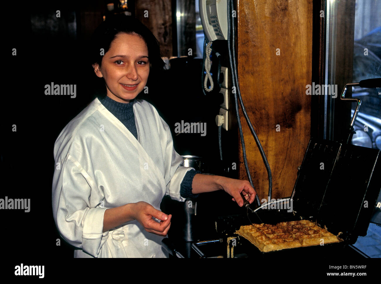 1, one, Belgian woman, cooking waffles, wafels, waffles of Liege ...