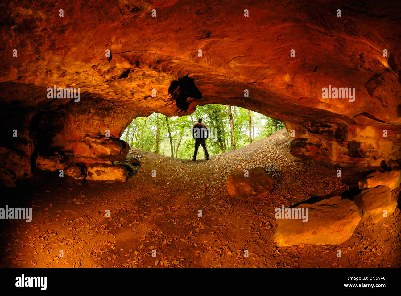 Walker stood in the entrance to a cave on the Sandstone Trail in ...