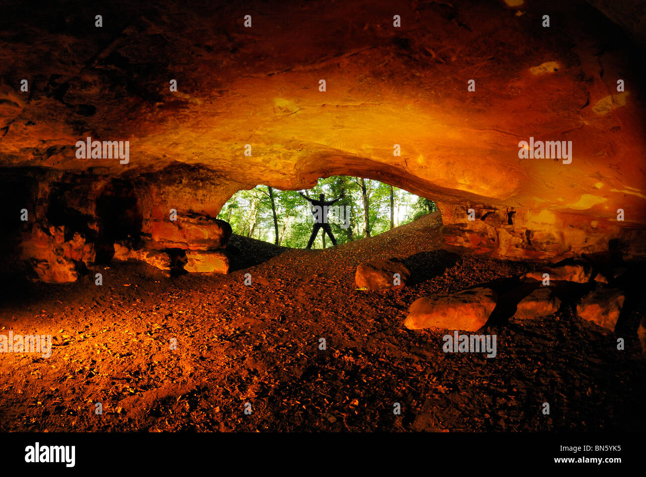Walker stood in the entrance to a cave on the Sandstone Trail in ...