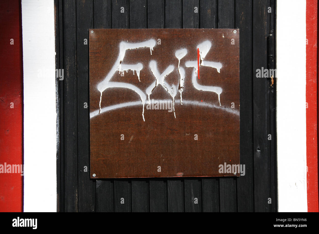 Dripping graffiti exit sign sprayed on a door Stock Photo - Alamy