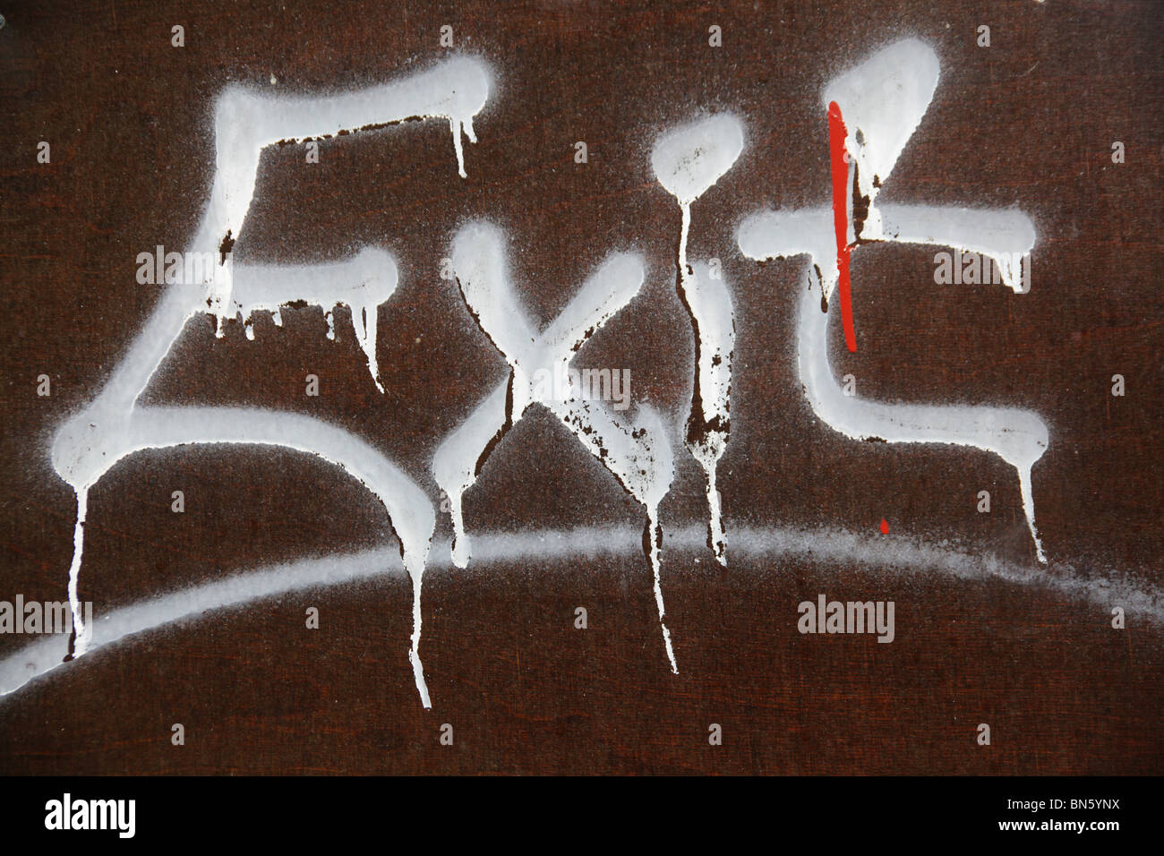 Dripping graffiti exit sign sprayed on a door Stock Photo - Alamy