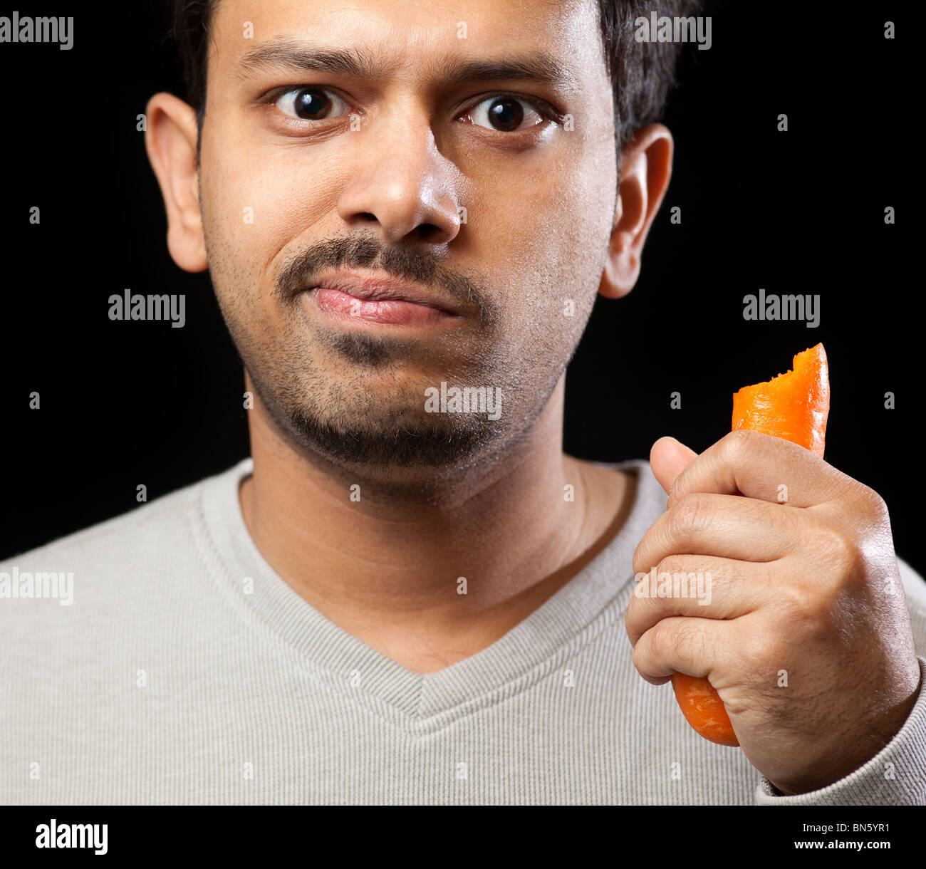 Male model having carrot hi-res stock photography and images - Alamy