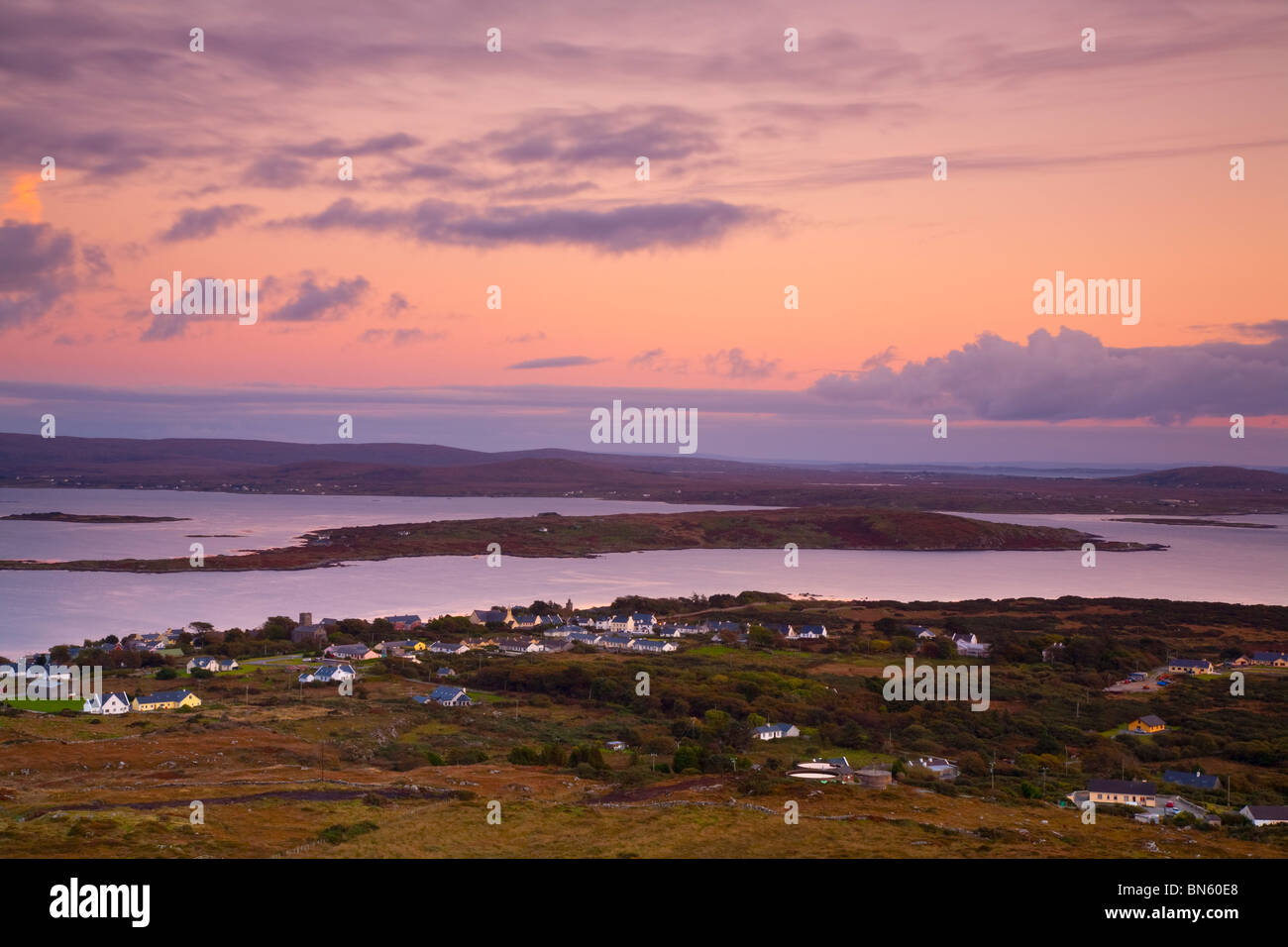 Elevated view over the coastal fishing village of Roundstone at dusk ...